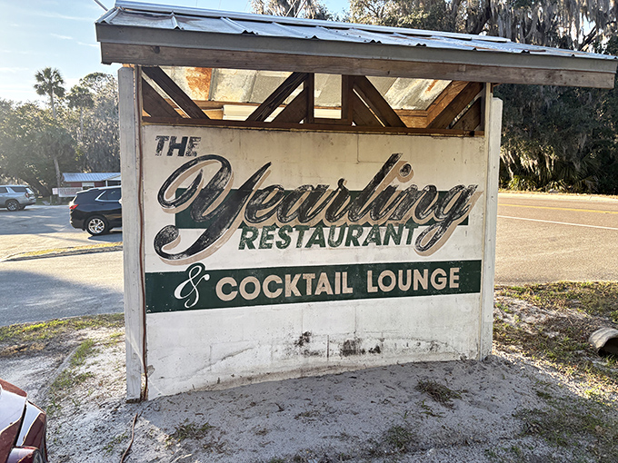 The weathered sign announces your arrival at a true Florida landmark, where literary history and culinary excellence have merged for decades.