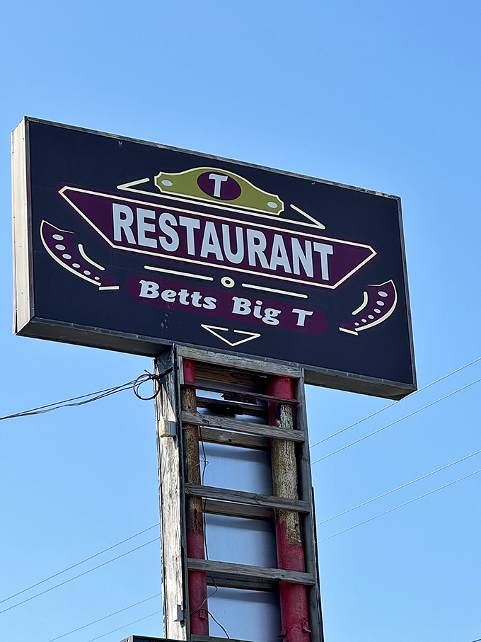 The iconic Betts Big T sign beckons hungry travelers like a lighthouse for those seeking refuge from chain restaurant mediocrity.