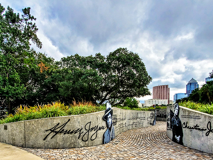 Sunset casts magical light across brick pathways, transforming sculptures into silhouettes against Tampa's evening sky.