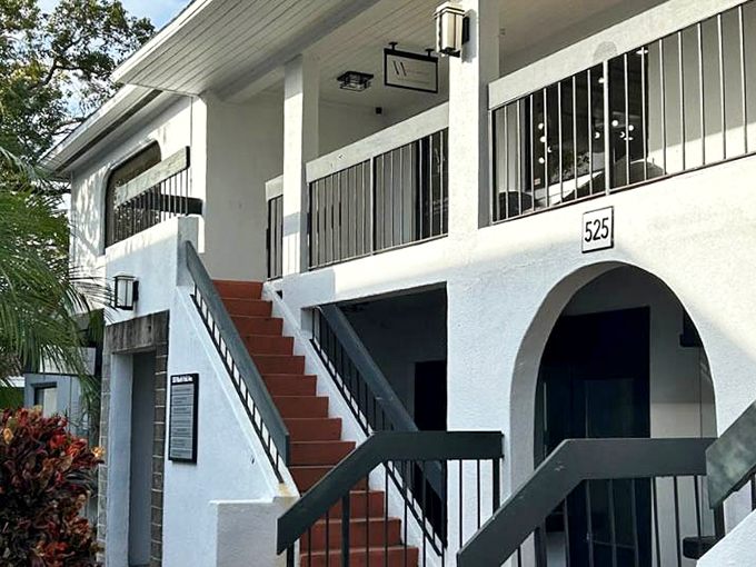 Vanity Artistry's distinctive white architecture showcases Winter Park's attention to detail, where even business entrances become photo opportunities.