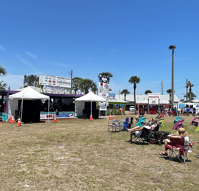 Festival grounds buzz with excitement as colorful tents promise smoky barbecue treasures waiting to be discovered by hungry visitors.