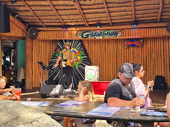 Guanabanas' thatched-roof stage comes alive with live music while diners enjoy tropical cocktails in this jungle-like paradise.