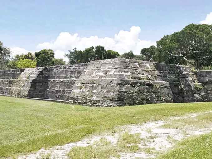 Ancient coquina walls stand silent under Florida's blue skies, their original purpose still debated by historians.