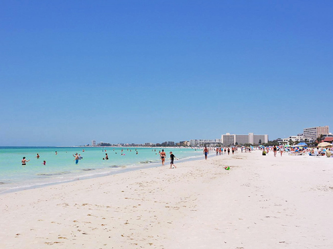 Siesta Beach's famous white quartz sand stretches like sugar along turquoise waters, creating a paradise that feels almost too perfect to be real.