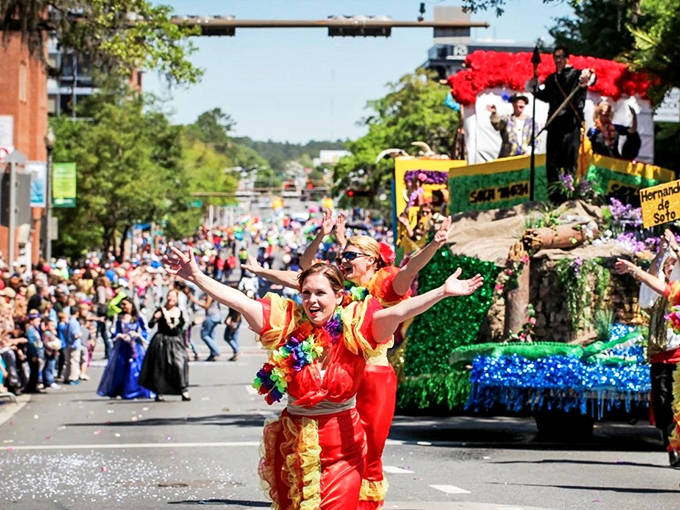 Dancers in vibrant costumes bring energy to the Springtime Tallahassee parade, delighting crowds lining the downtown streets.