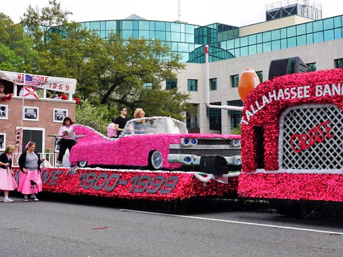 A pink-flowered float rolls through downtown Tallahassee, showcasing the creativity and community spirit of this beloved spring tradition.