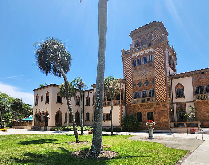 Palm trees frame the ornate tower of The Ringling, where circus history and fine art create a uniquely Floridian cultural paradise.