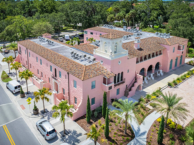 Aerial Angle: From above, the Hacienda's terracotta rooftops and elegant courtyards create a Spanish Colonial oasis amid the Florida landscape – architectural poetry in pink stucco.