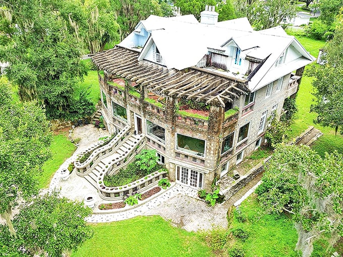 From above, the Wonder House reveals its unusual footprint, nestled among lush Florida greenery like a concrete island in a verdant sea.