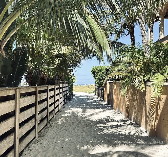 Beach Access Sand Path Nature's VIP entrance &ndash; a sandy corridor flanked by swaying palms leading to Bean Point's pristine shores.