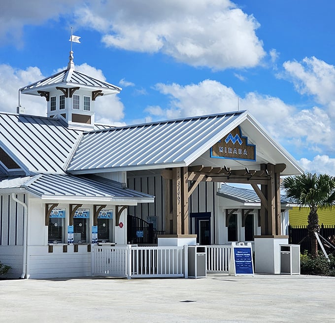 Coastal charm meets vacation vibes at Mirada Lagoon's welcoming entrance, where Florida architecture sets the stage for tropical adventures.