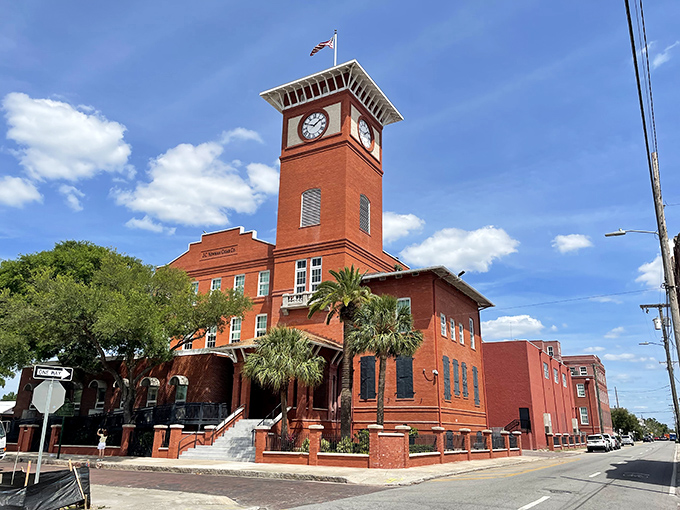 Palm trees frame this architectural beauty, where tradition meets tropical paradise. The building practically whispers stories from another era.