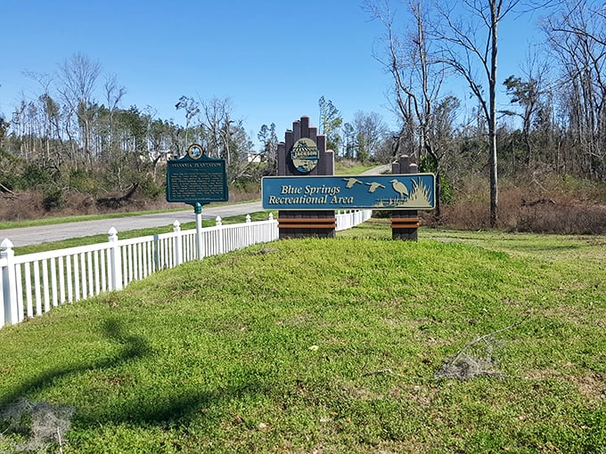 Welcome to paradise! The entrance sign to Blue Springs Recreation Area promises adventure while the historical marker hints at stories from the past.