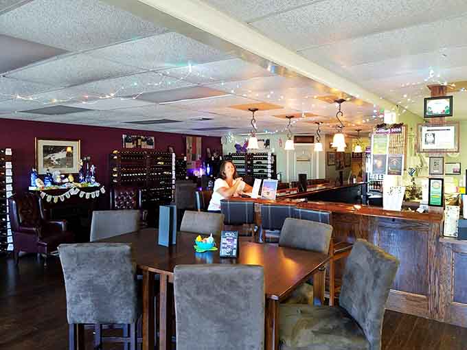 Twinkling lights create an intimate escape where wine flows and strip mall reality fades into distant memory.