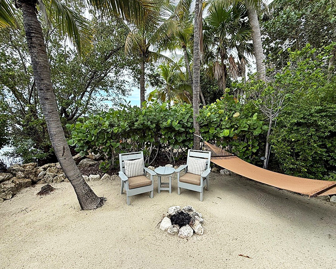Two comfortable chairs nestled between palm trees create the perfect spot for morning coffee or sunset cocktails.