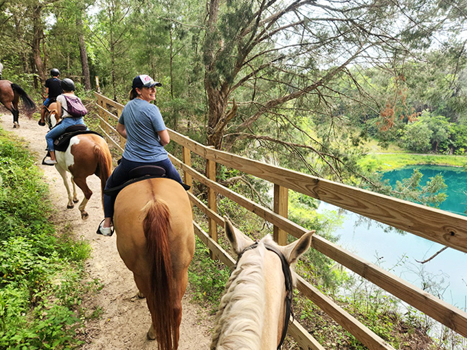 Riders follow paths where limestone cliffs meet emerald waters, creating a scene that feels magically misplaced in Florida.