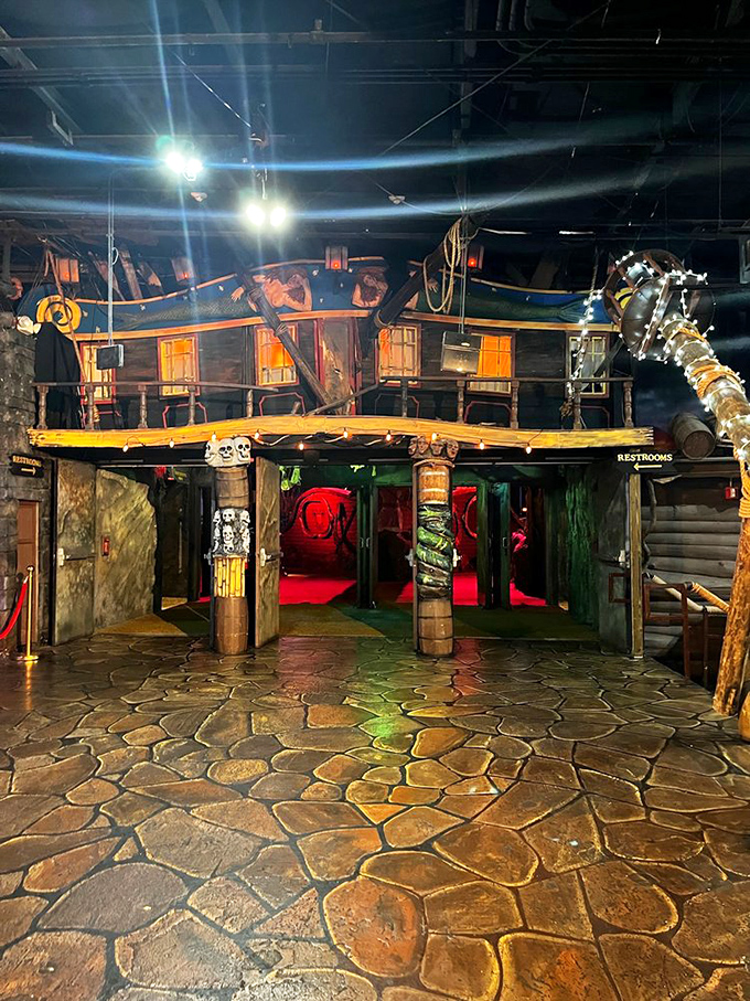 Step inside and you're transported to a weathered pirate ship interior, where atmospheric lighting sets the stage for swashbuckling drama.