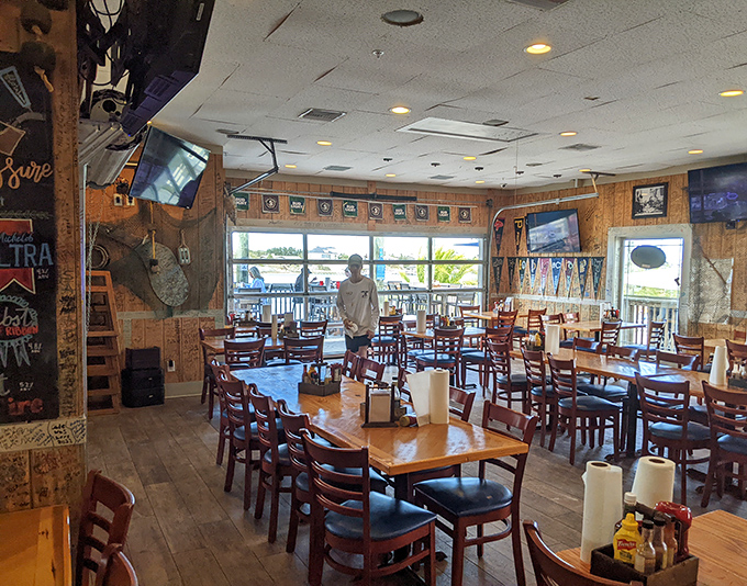 Inside, wooden tables await hungry patrons while memorabilia-covered walls tell stories of decades of good times and great meals.