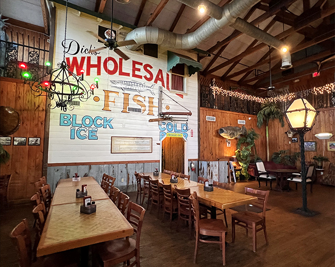 Rustic charm meets maritime history: The "Dick's WHOLESALE FISH" sign hints at the building's past while twinkling lights create an atmosphere of casual elegance.