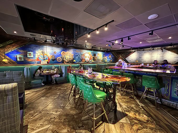 Vibrant murals and emerald green seating create an atmosphere that's as lively as the flavors coming from the kitchen.