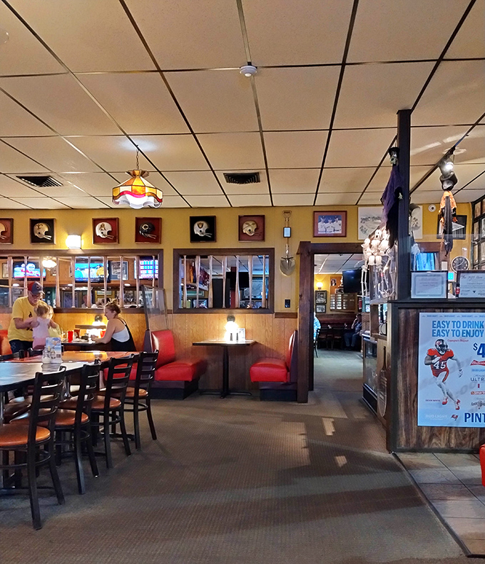 Red booths and sports memorabilia create that perfect "been-here-forever" vibe where memories are made between bites of pizza and sips of cold beer.