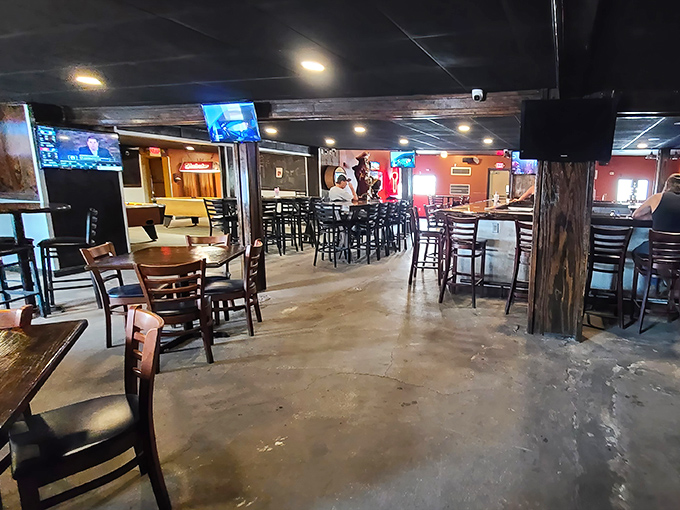 Wooden beams and concrete floors create that perfect "been here forever" vibe where memories are made between bites of legendary burgers.