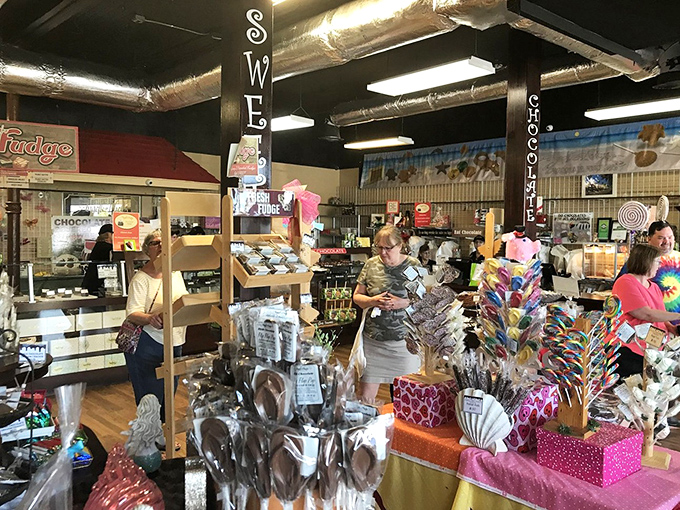 Interior: Shelves bursting with colorful treats create a candy wonderland where willpower goes to die a delicious death.