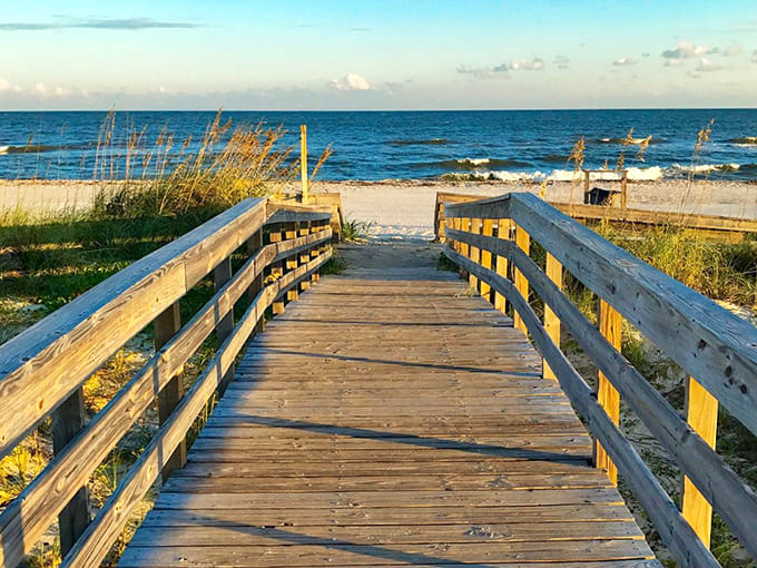 Wooden boardwalk: Nature's red carpet leading to aquamarine waters. This weathered walkway promises adventure with every creaking step.