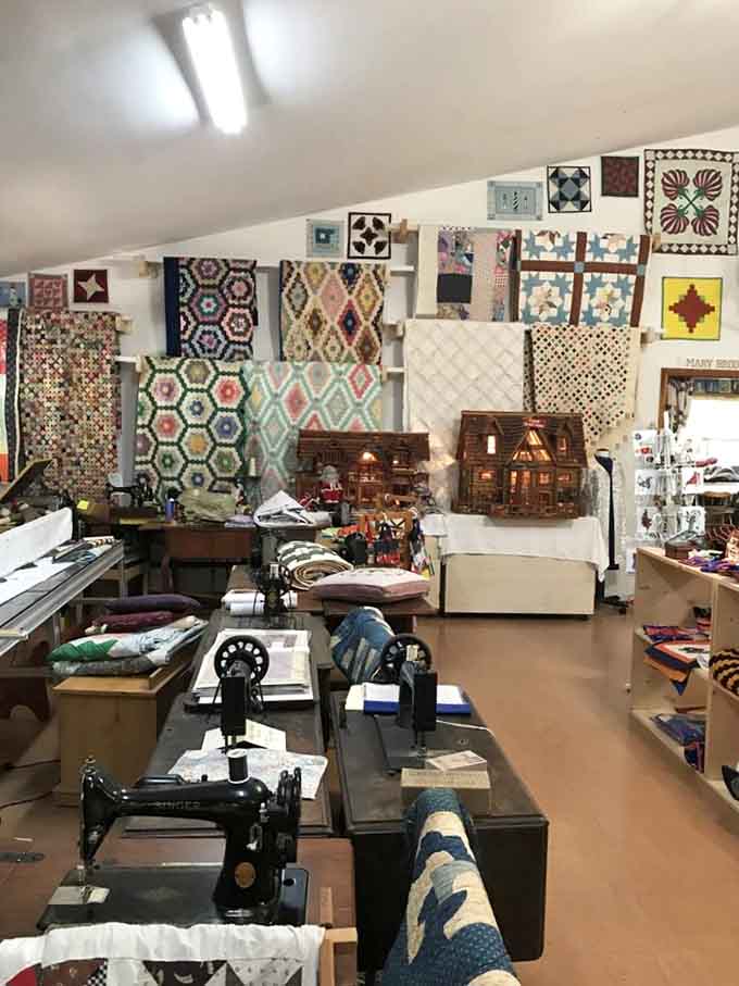 Inside, walls burst with colorful quilts like a fabric rainbow exploded in the best possible way.