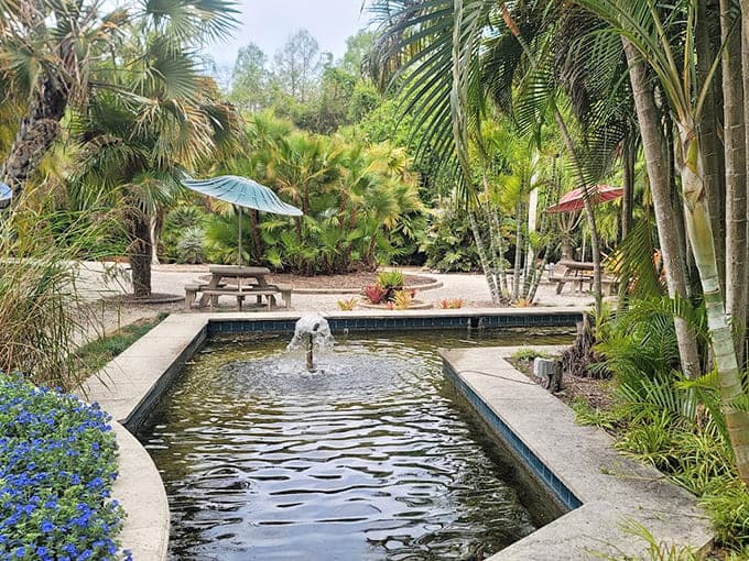 This tiered fountain creates a peaceful focal point, its gentle cascades providing both visual beauty and soothing sounds that complement the garden's playful energy.