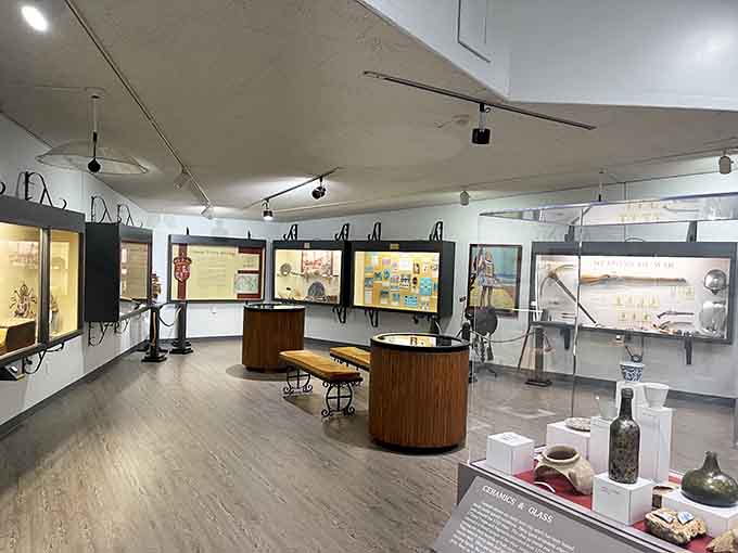 Inside, history unfolds in carefully curated displays that transform salvaged artifacts into windows to another time and place.