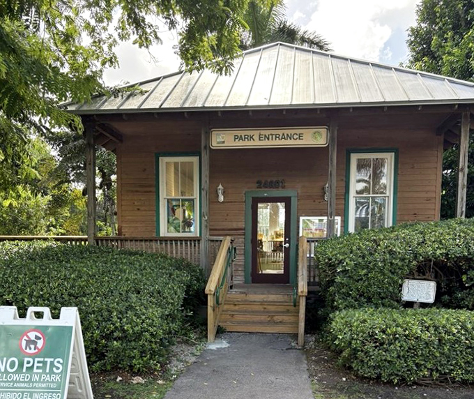 The rustic park entrance building welcomes plant enthusiasts with its charming wooden facade and metal roof.
