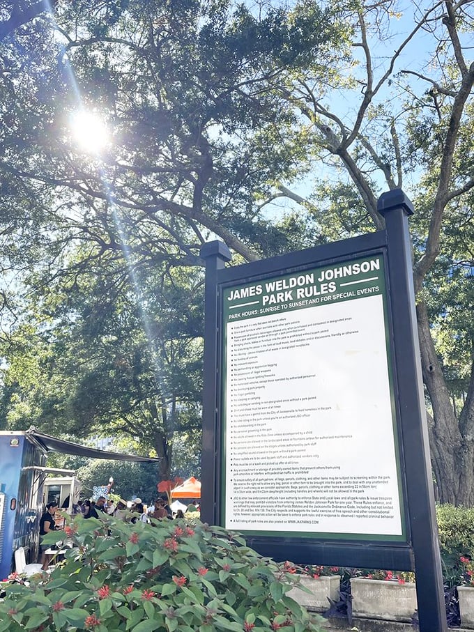 Rules are meant to be followed, but at James Weldon Johnson Park, even the regulations sign stands beneath a canopy of magnificent trees.