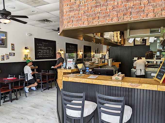 Inside Pino's, the open kitchen and casual vibe create the perfect setting for serious pizza consumption.