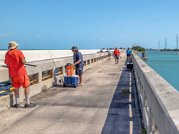 Local fishermen line the pedestrian bridge, their patience rewarded with both catches and camaraderie in Marathon's community-centered outdoor lifestyle.