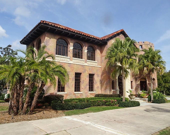 Mediterranean Revival architecture at its finest &ndash; the side facade showcases the mansion's perfect proportions and warm terracotta hues.