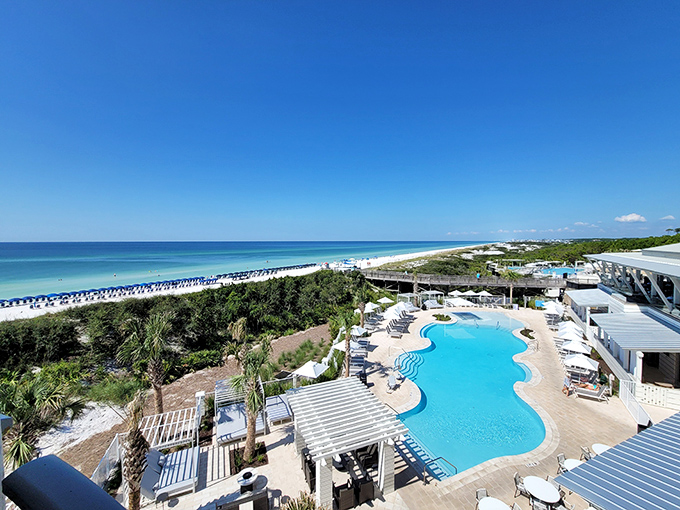 A bird's-eye view reveals Seaside's perfect symmetry &ndash; a beachfront pool that mirrors the Gulf's blue hues while white buildings gleam in the sunshine.