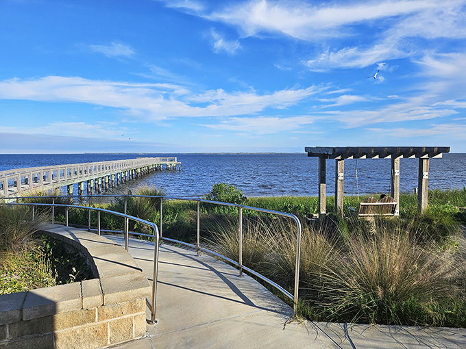 This wooden pier invites contemplation as it reaches toward the horizon, offering front-row seats to nature's daily spectacle.