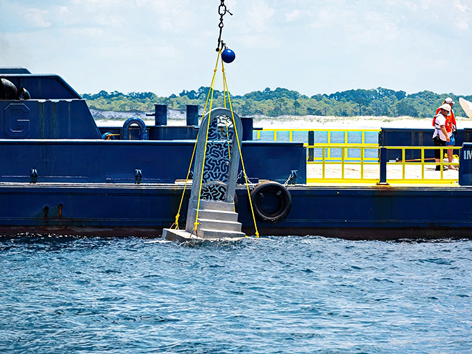 Heavy machinery and careful planning come together as another masterpiece begins its journey to the ocean floor.