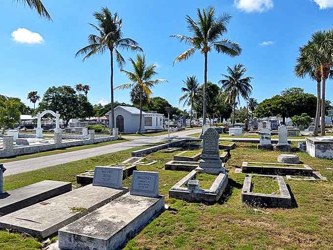 Rows of pristine white graves stretch toward the horizon, creating a striking contrast against the vibrant blue Florida sky.