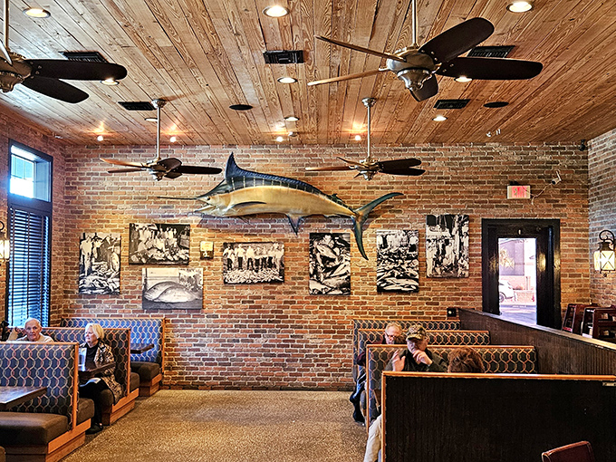 Exposed brick walls meet wooden ceilings while a magnificent marlin keeps watch over diners enjoying coastal comfort food.