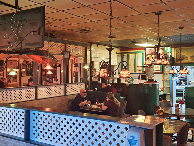 Step inside to a world where lattice dividers, warm lighting, and cozy seating create the perfect backdrop for memorable Italian feasts.