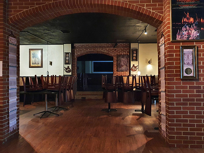 Step through the arched brick entryway into a warm, inviting space where Thai culinary traditions come alive.