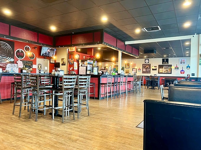 The warm, inviting interior strikes the perfect balance between casual dining and comfortable hangout, with red accents brightening the space.