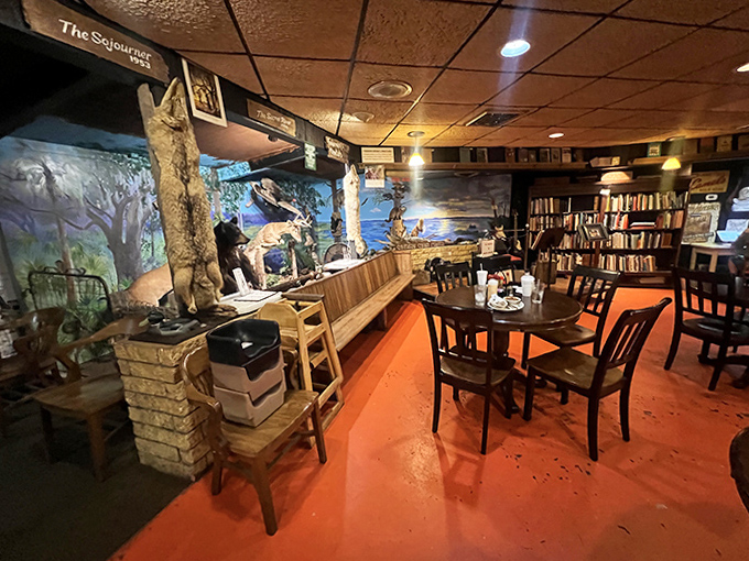 Step inside to discover a dining room where literature meets local flavor, complete with wooden tables, orange floors, and enough books to start your own library.