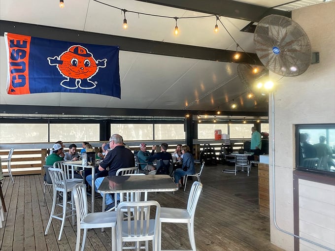 Inside, Syracuse pride meets Florida casual. The string lights aren't just decoration&mdash;they're beacons guiding hungry souls to barbecue salvation.