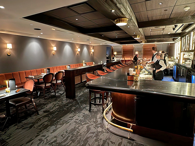 The sleek bar area at Bern's offers a sophisticated prelude to your dining adventure, where mixologists craft cocktails with theatrical precision.