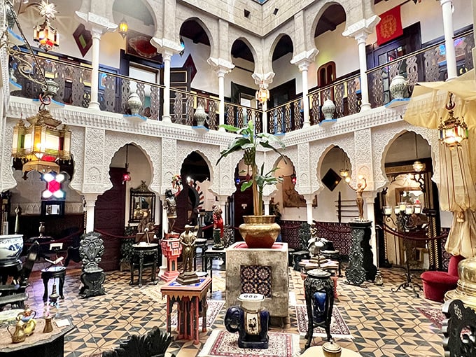 The breathtaking central courtyard where Moorish arches frame a multi-level atrium, creating a theatrical space worthy of Arabian Nights.