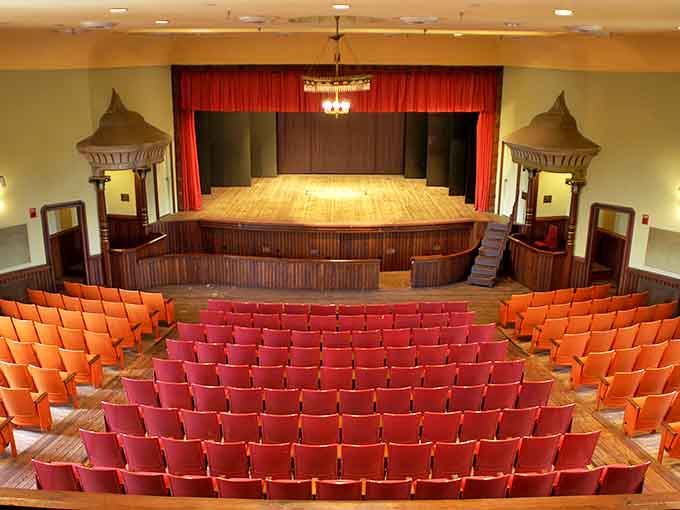 Rows of vintage seating face the historic stage, where acoustics designed for unamplified performances still create magical sound experiences today.