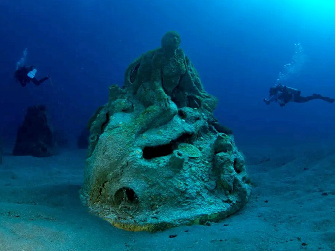 This hauntingly beautiful mermaid sculpture creates an underwater selfie opportunity that'll make your Instagram followers green with envy.